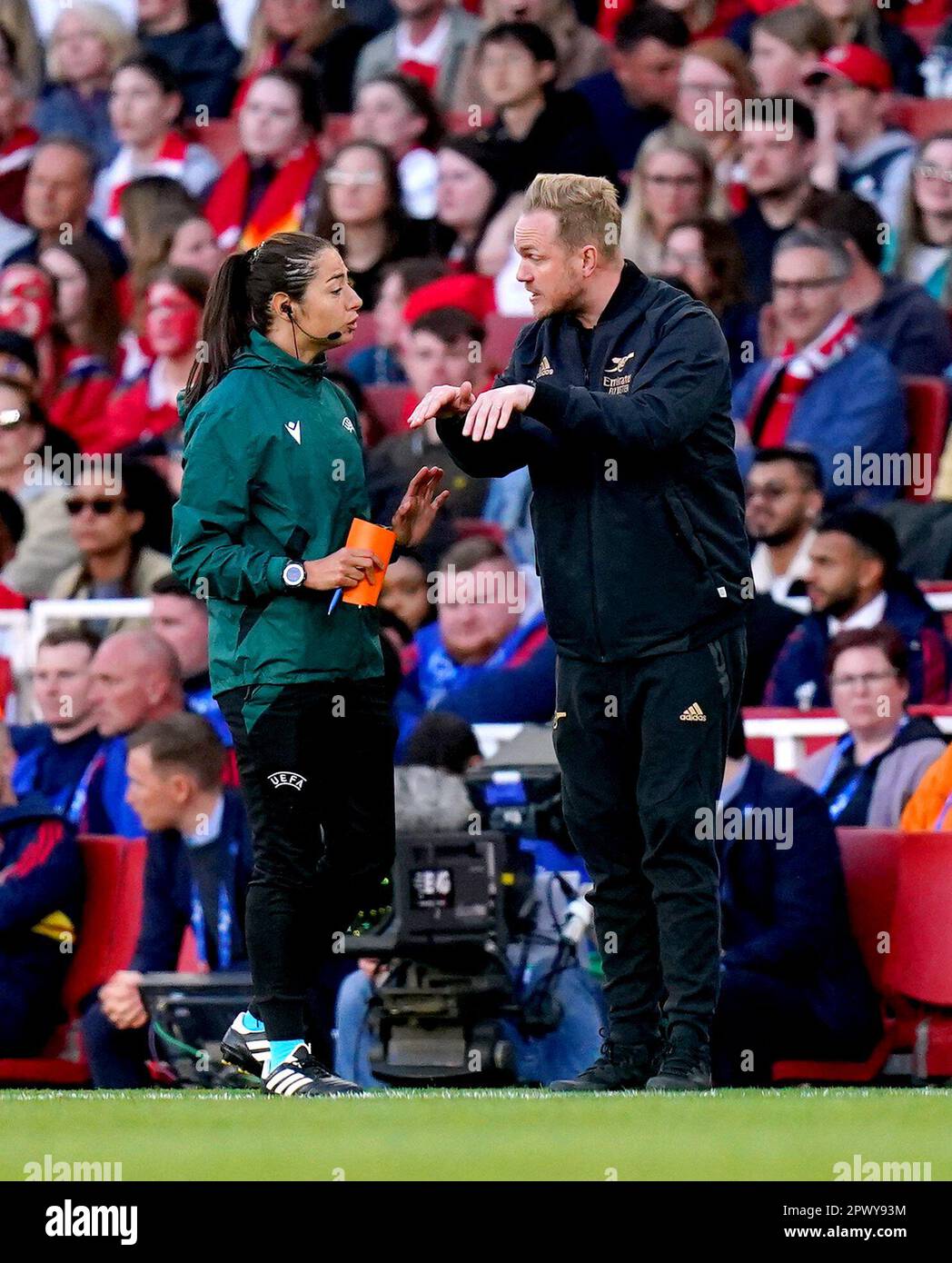 Arsenal manager Jonas Eidevall speaks to a match official during the ...
