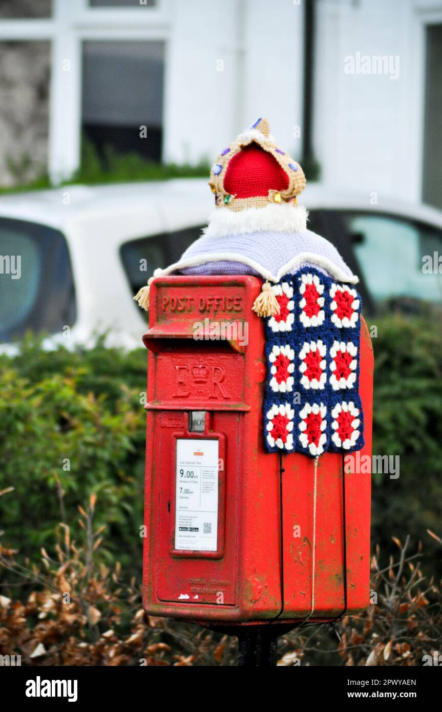 A coronation themed crocheted post box topper celebrating the ...