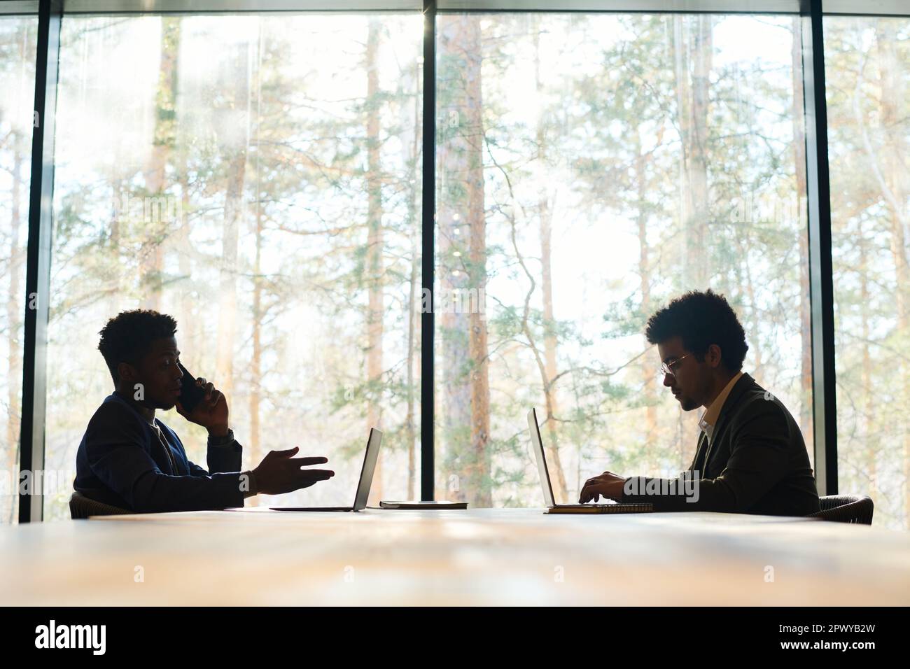 Talking male colleague typing hi-res stock photography and images - Alamy