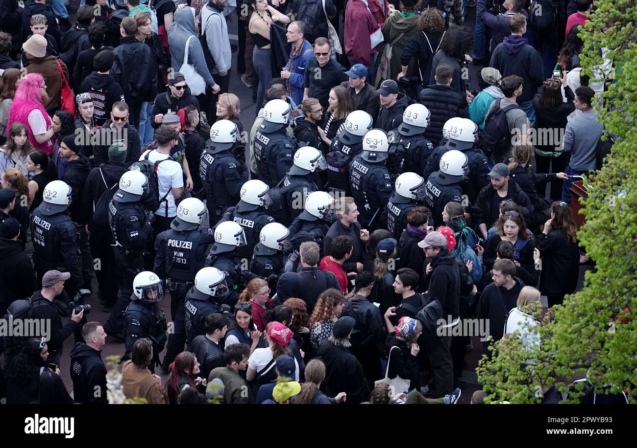 A demonstration marches under police escort during a May Day rally in ...