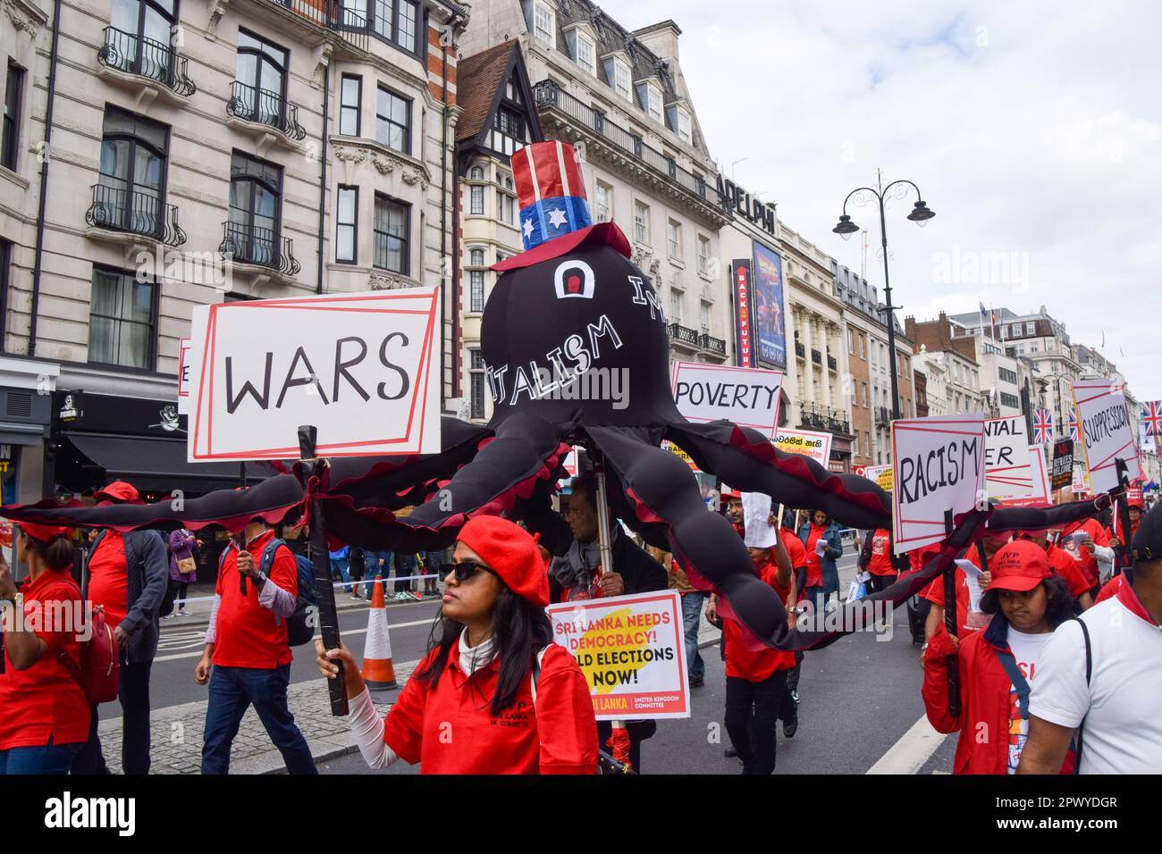 London, England, UK. 1st May, 2023. Anti-capitalism protesters pass ...