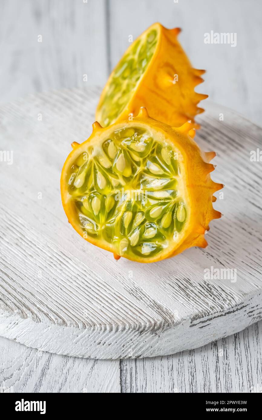 African horned cucumber on the wooden table Stock Photo - Alamy
