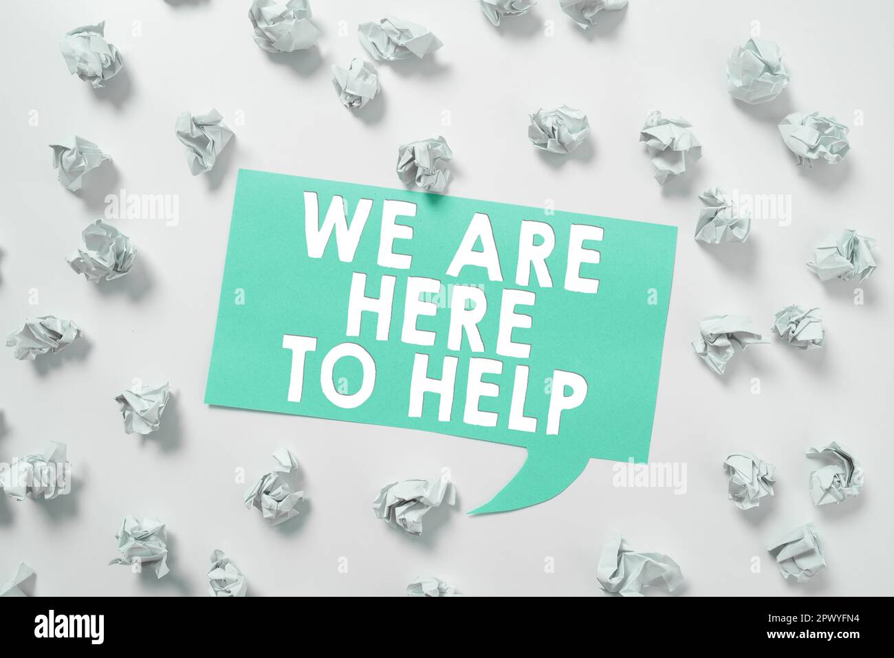 Hand writing sign We Are Here To Help, Word Written on Someone who is ...