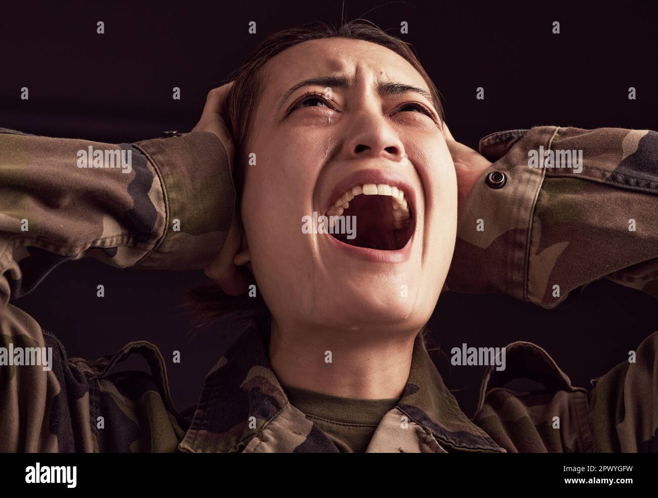PTSD, crying and trauma with a woman soldier shouting or screaming in ...