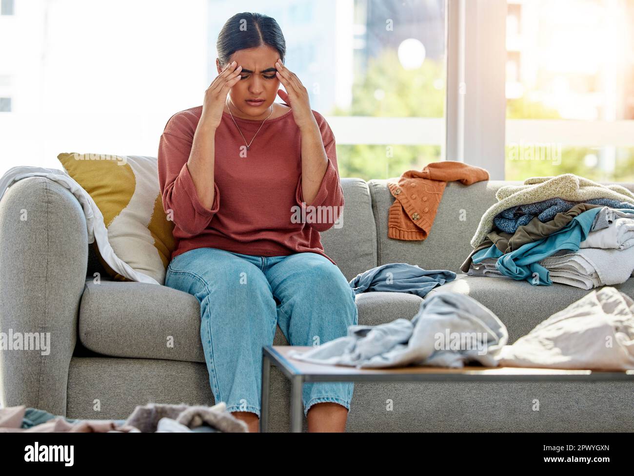 Home laundry sad girl clothes hi-res stock photography and images - Alamy