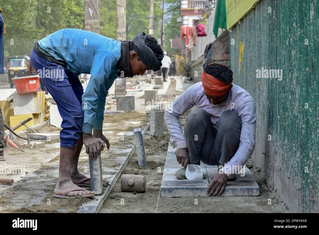 Srinagar, India. 01st May, 2023. Labourers work at a construction ...