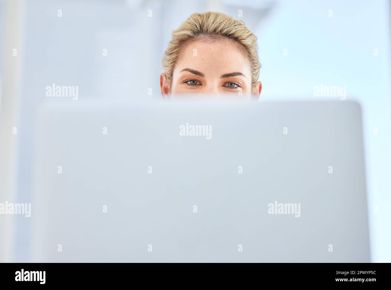 Woman, laptop and office for reading, research or focus with eyes, IT ...