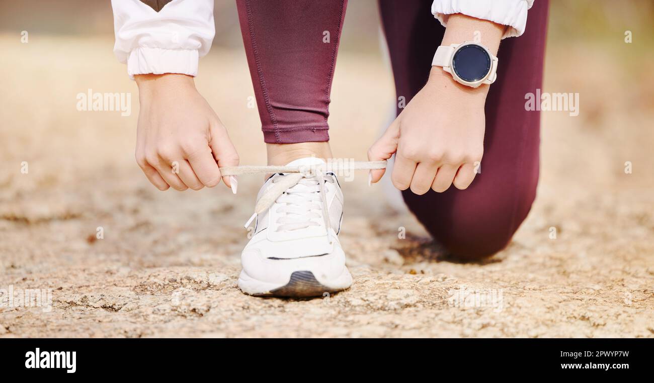 Woman, shoes lace and fitness runner outdoor in nature park for ...