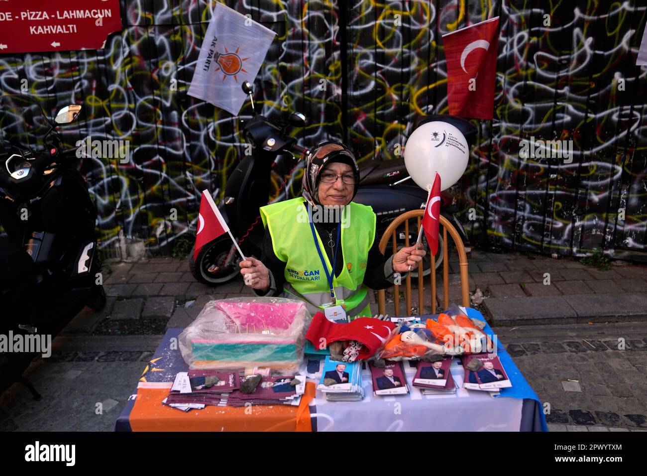 A woman representing the Turkish AK ruling party, poses for a ...