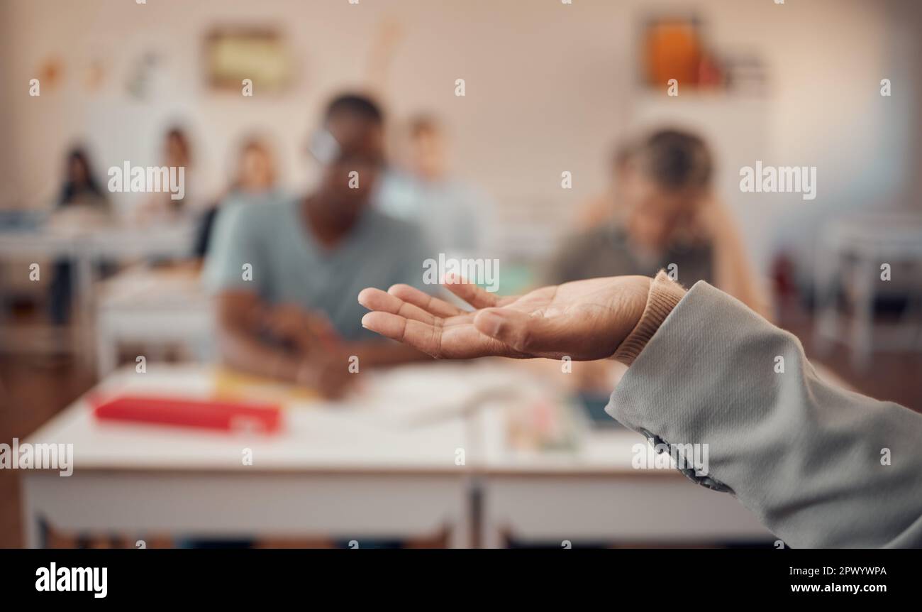 Hand, education and study with a teacher and students in a classroom ...