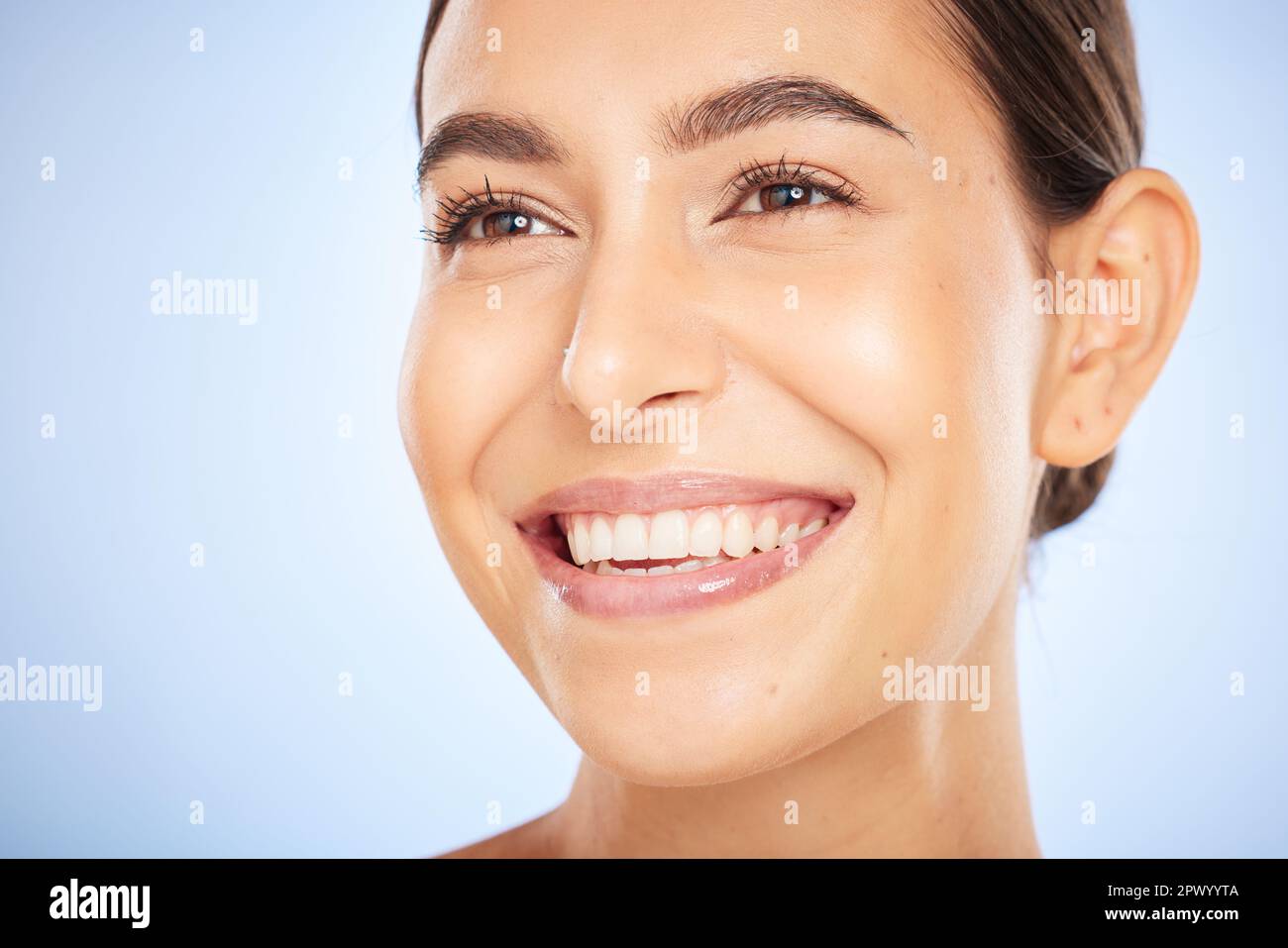 Skincare model face, smile and beauty by blue background for wellness ...
