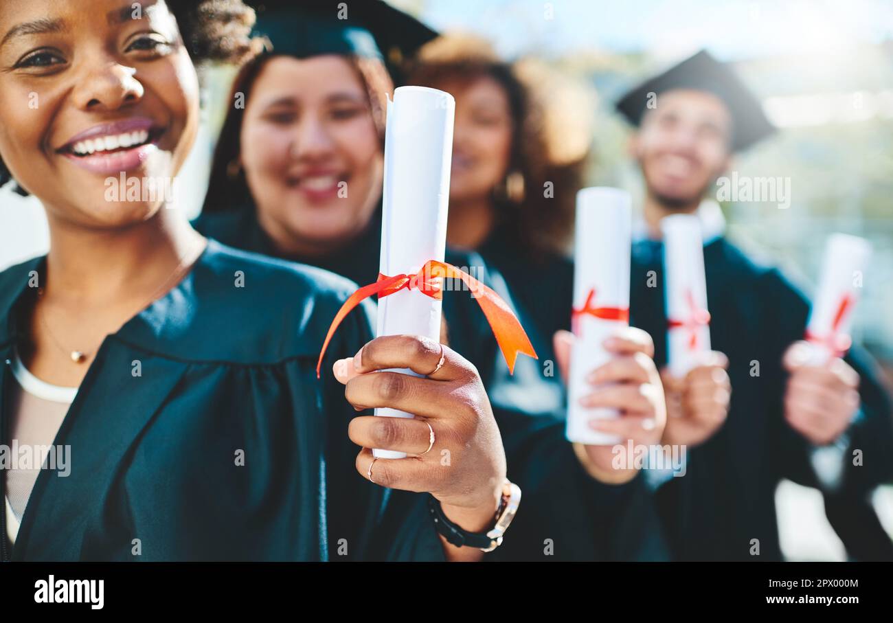 This will open doors. a group of students holding their diplomas on ...