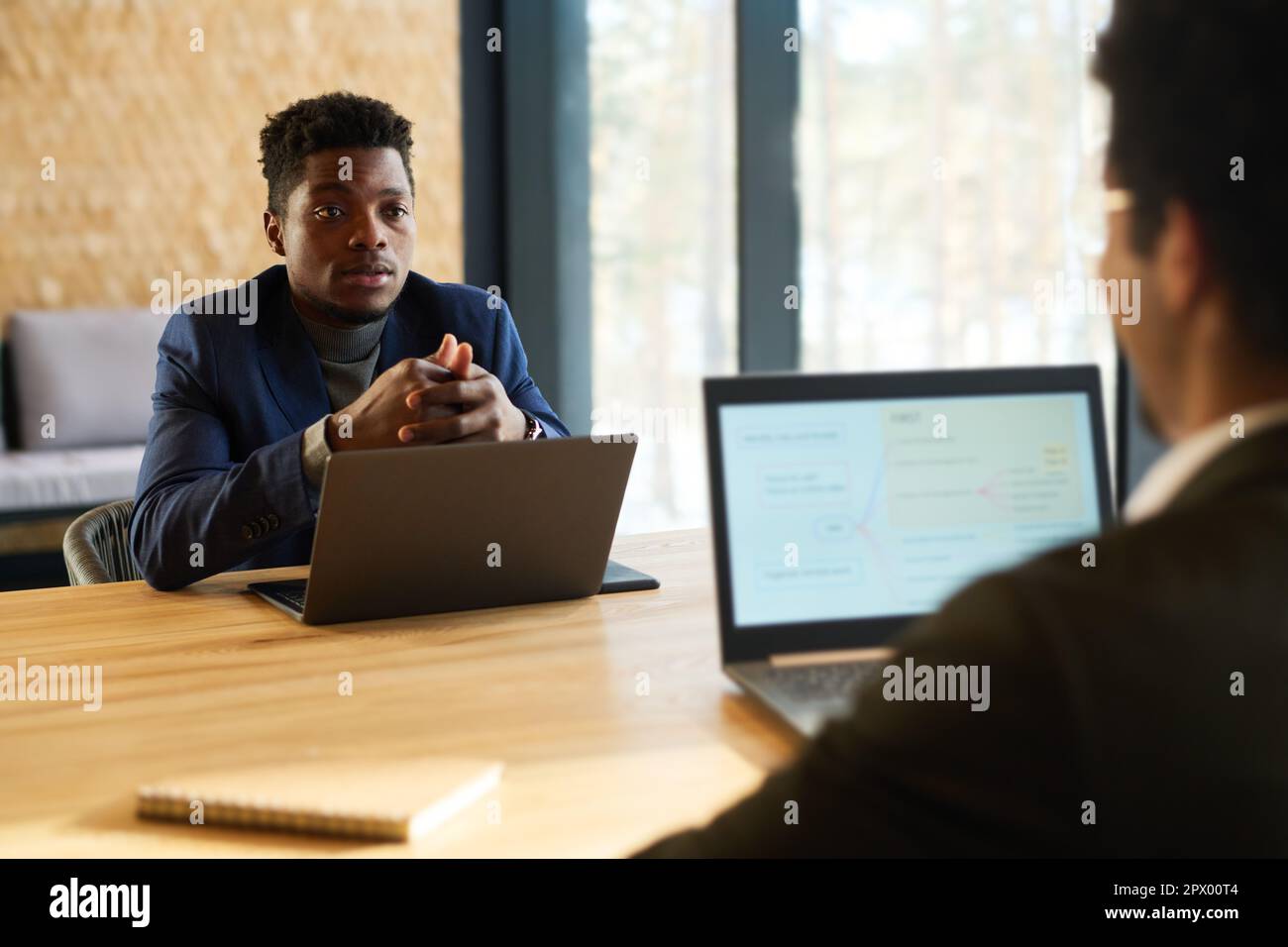 Confident African American male employer or HR manager with laptop ...