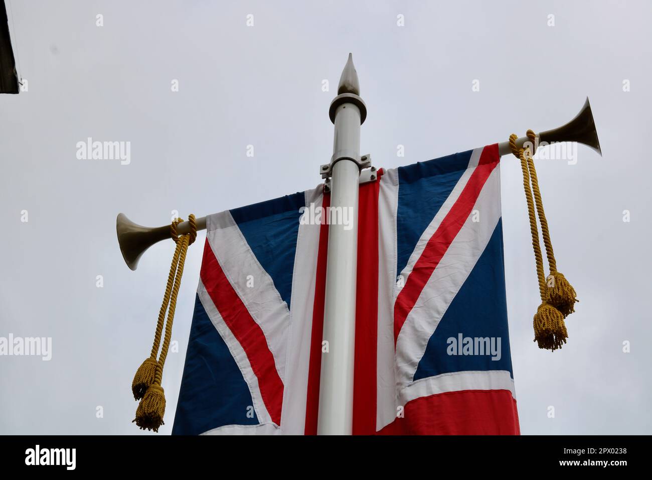 White lamp post decorated with Union Jack and gold tassels for King's ...