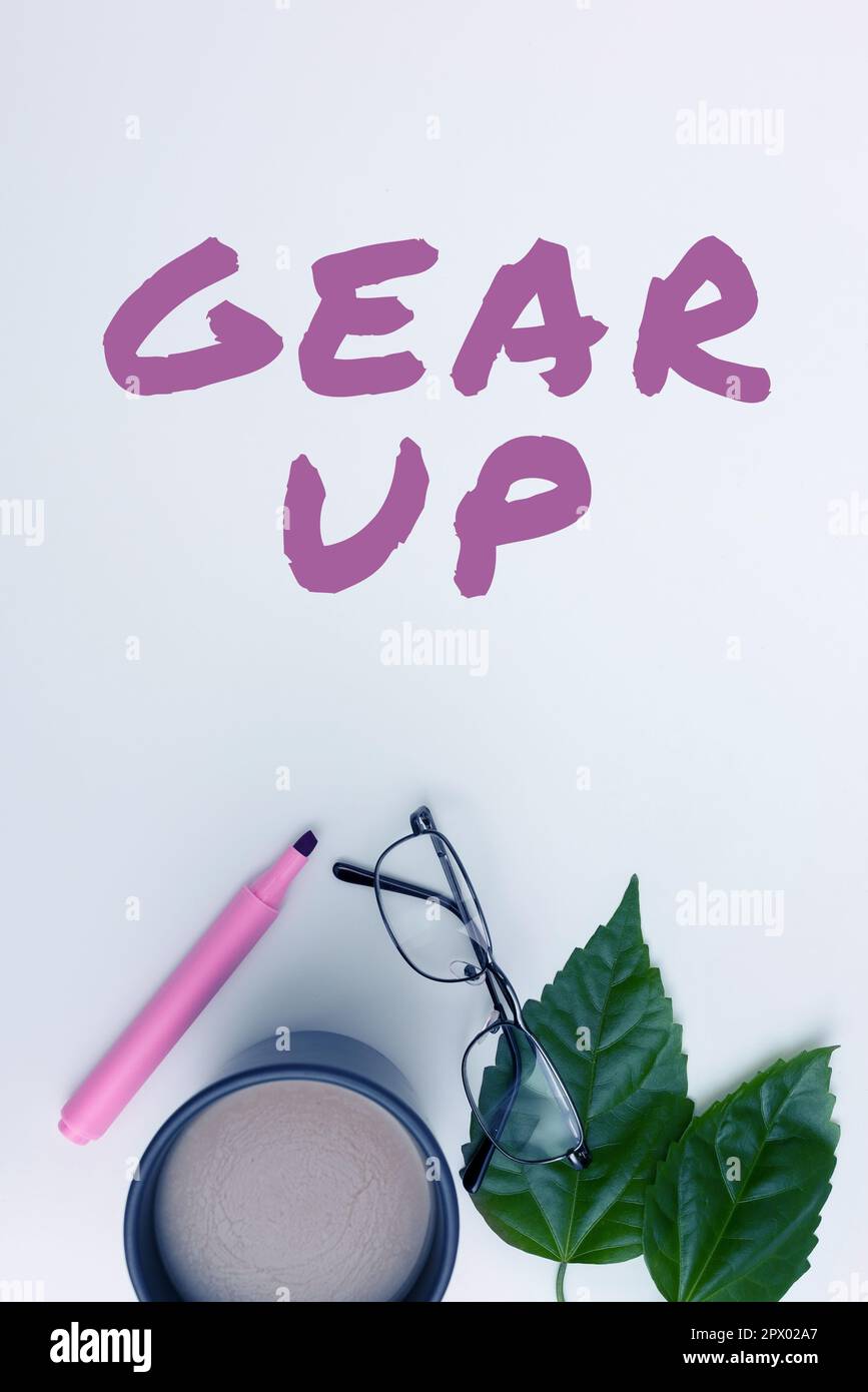 Hand writing sign Gear Up, Word Written on Asking someone to put his ...