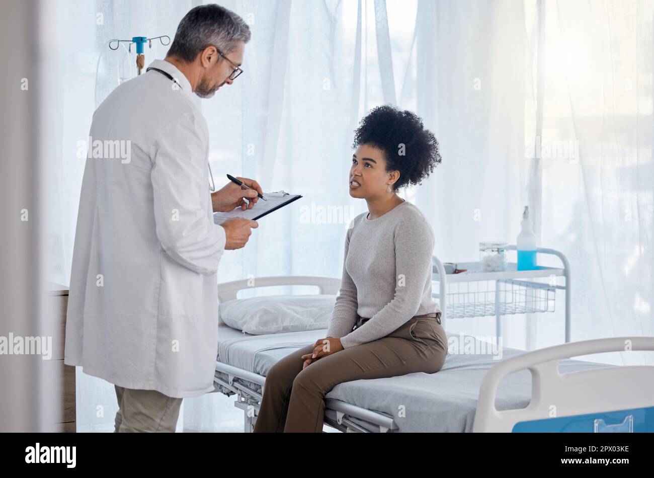 Healthcare, doctor and woman consulting for insurance, documents and ...