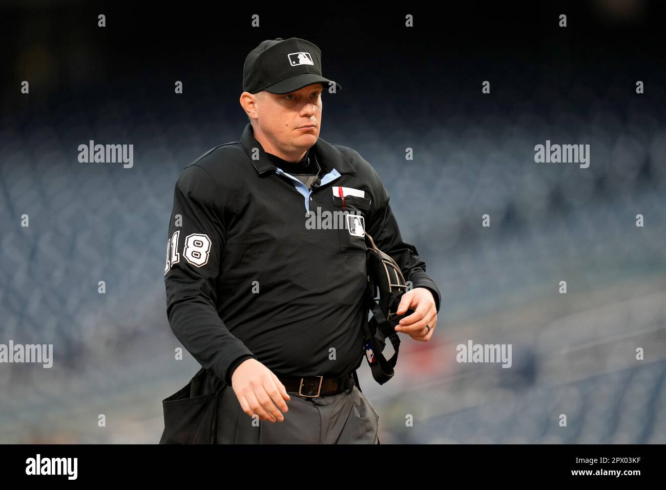 Umpire Ryan Wills walks on the field during a baseball game between the ...