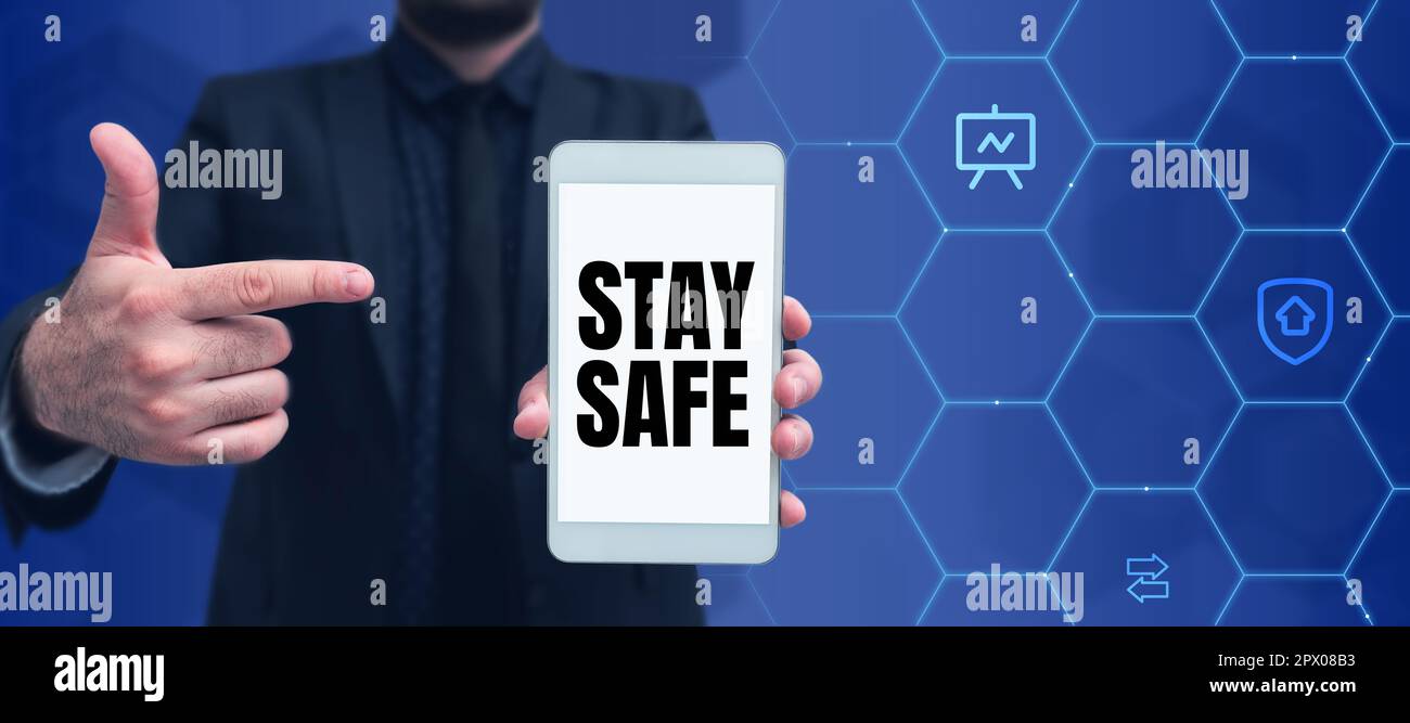 Text caption presenting Stay Safe, Concept meaning secure from threat ...