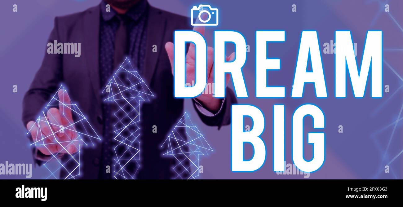 Sign displaying Dream Big, Word Written on To think of something high ...