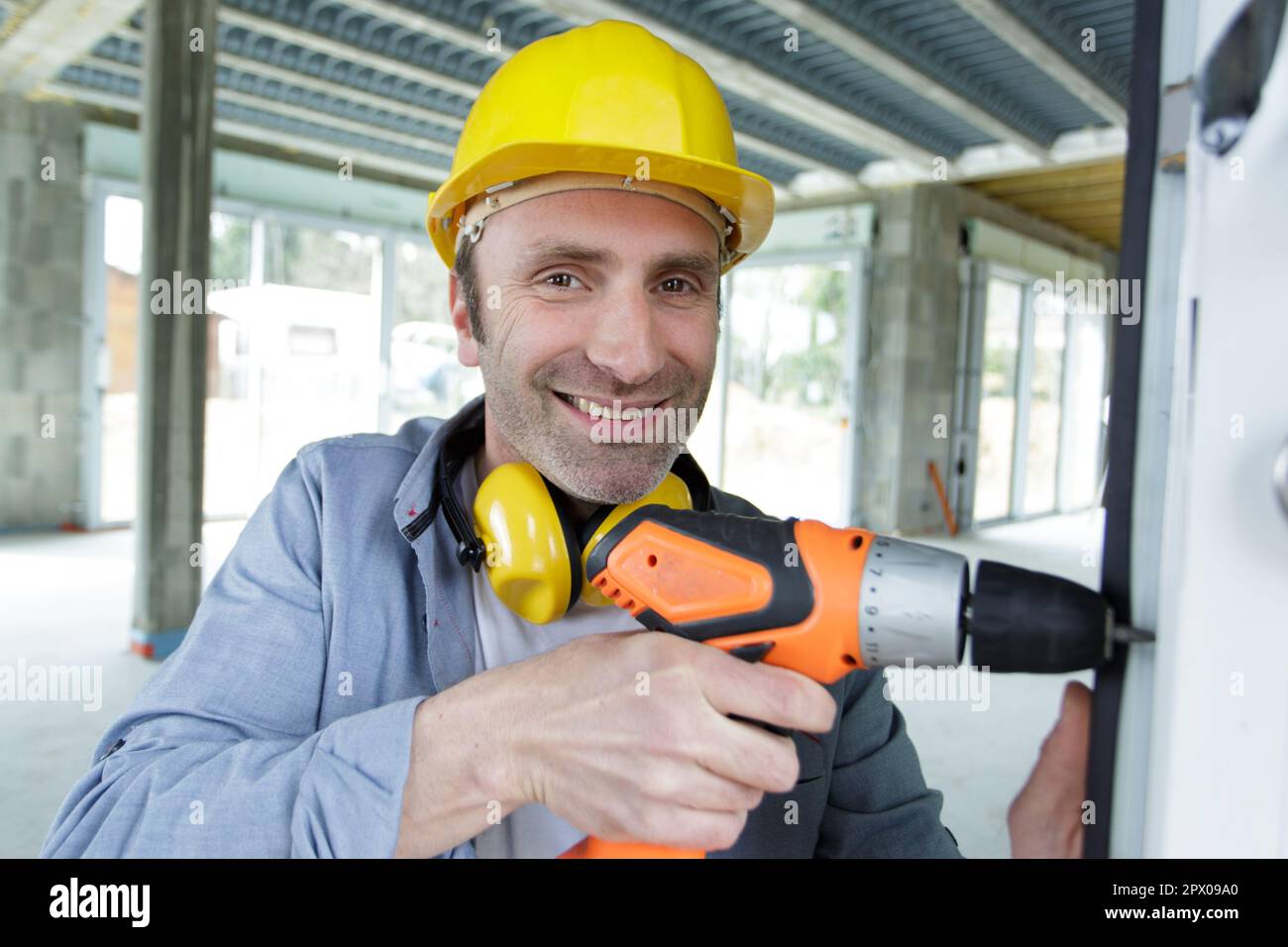 construction worker and handyman works on renovation of apartment Stock ...