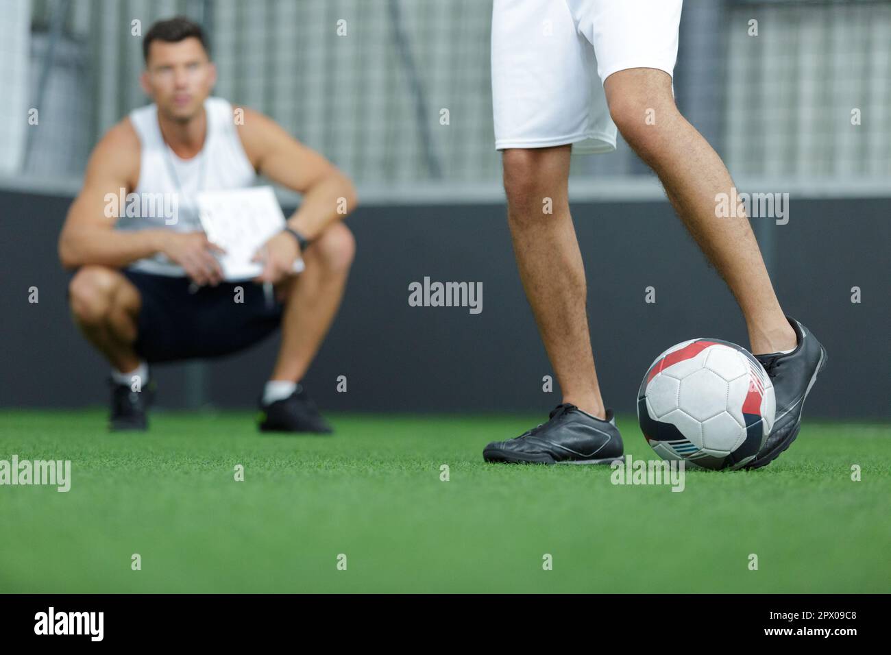 group of young men playing football on court Stock Photo - Alamy