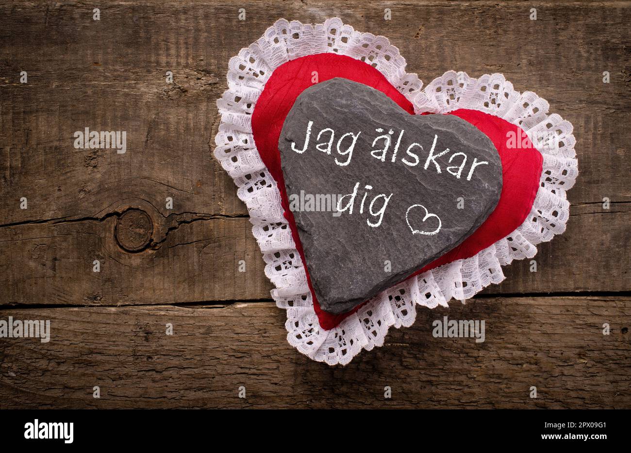 Heart shape of dark slate with the Swedish inscription Jag älskar dig ...