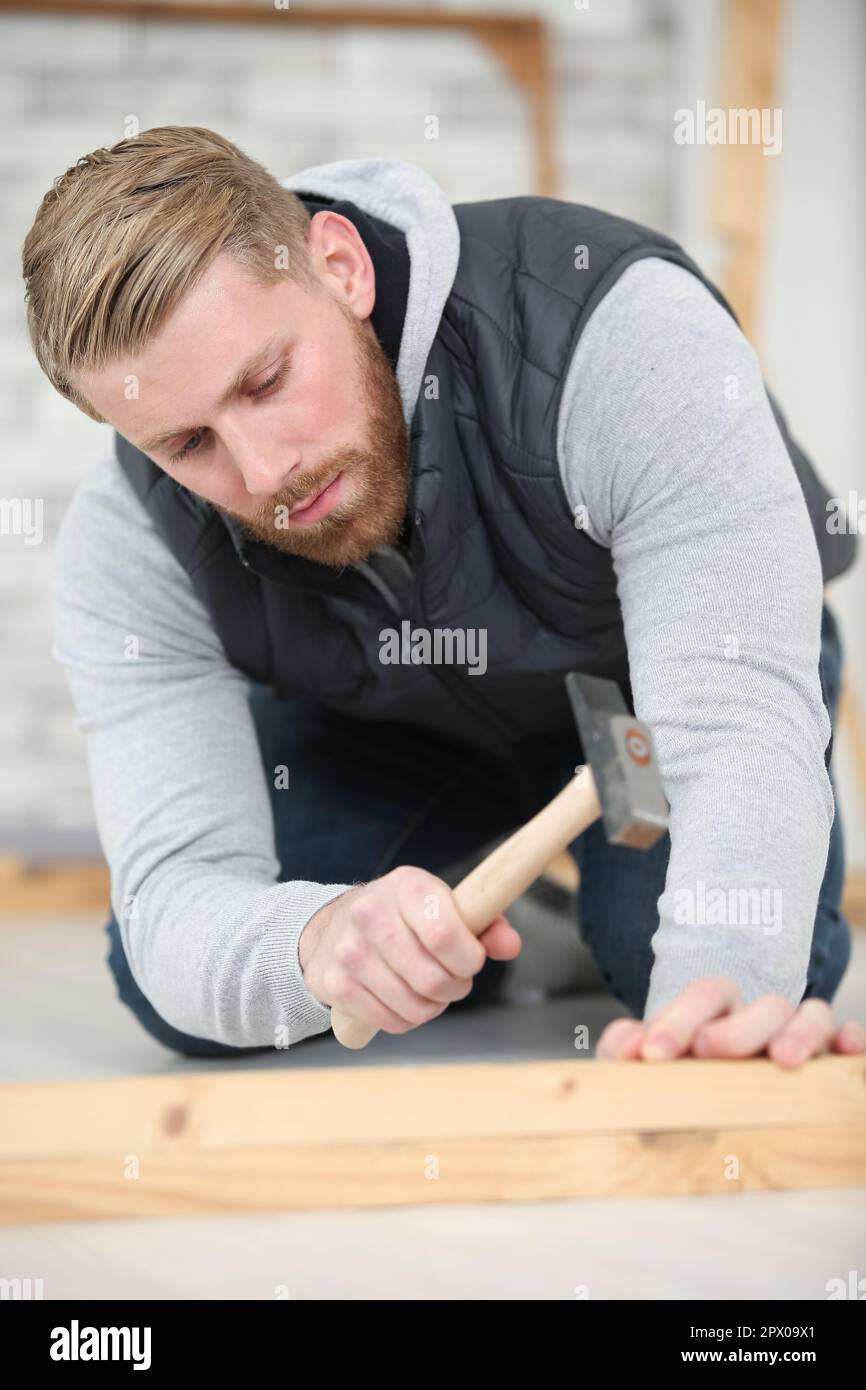 Hammers a nail hi-res stock photography and images - Alamy