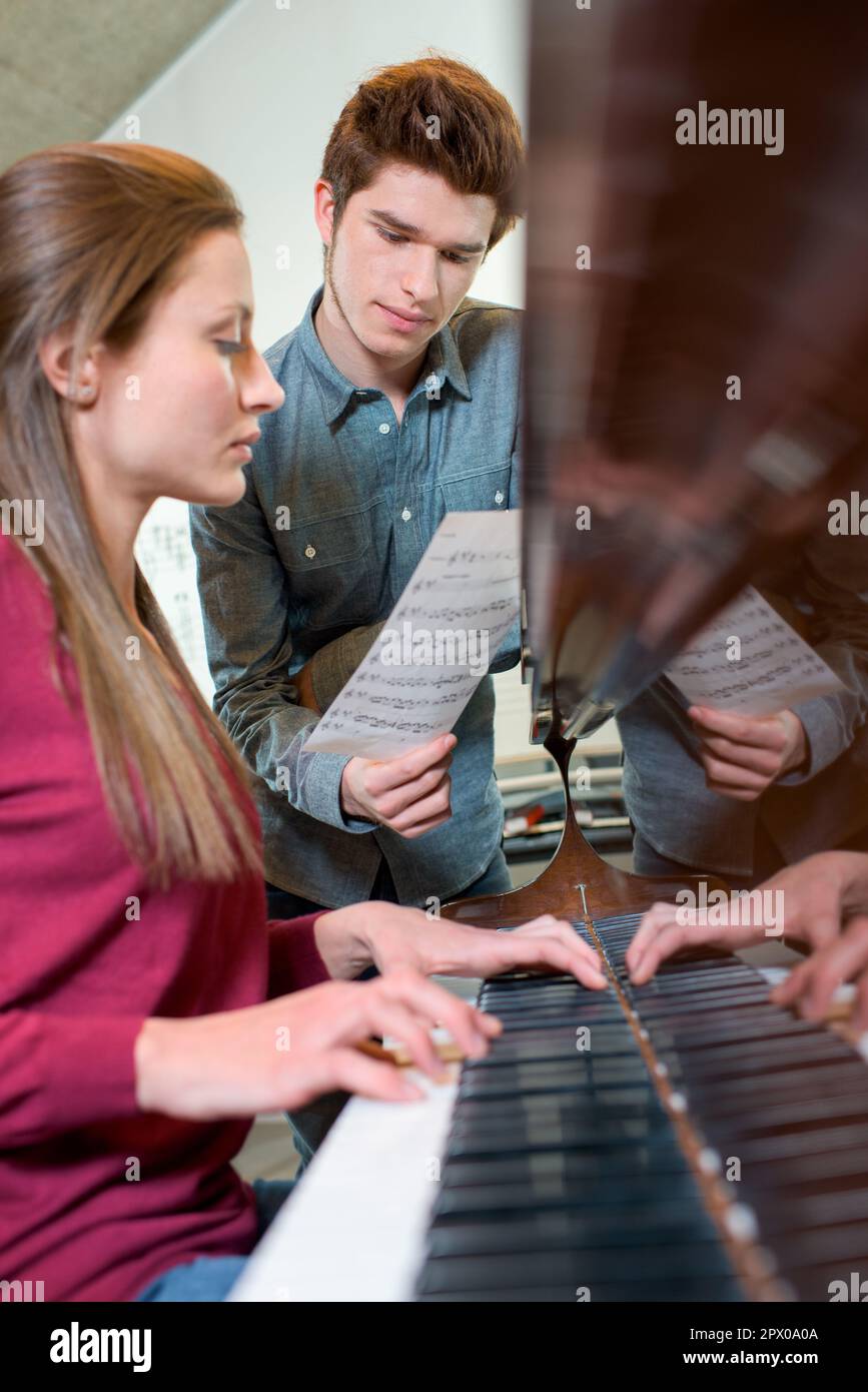 a young students playing piano Stock Photo - Alamy