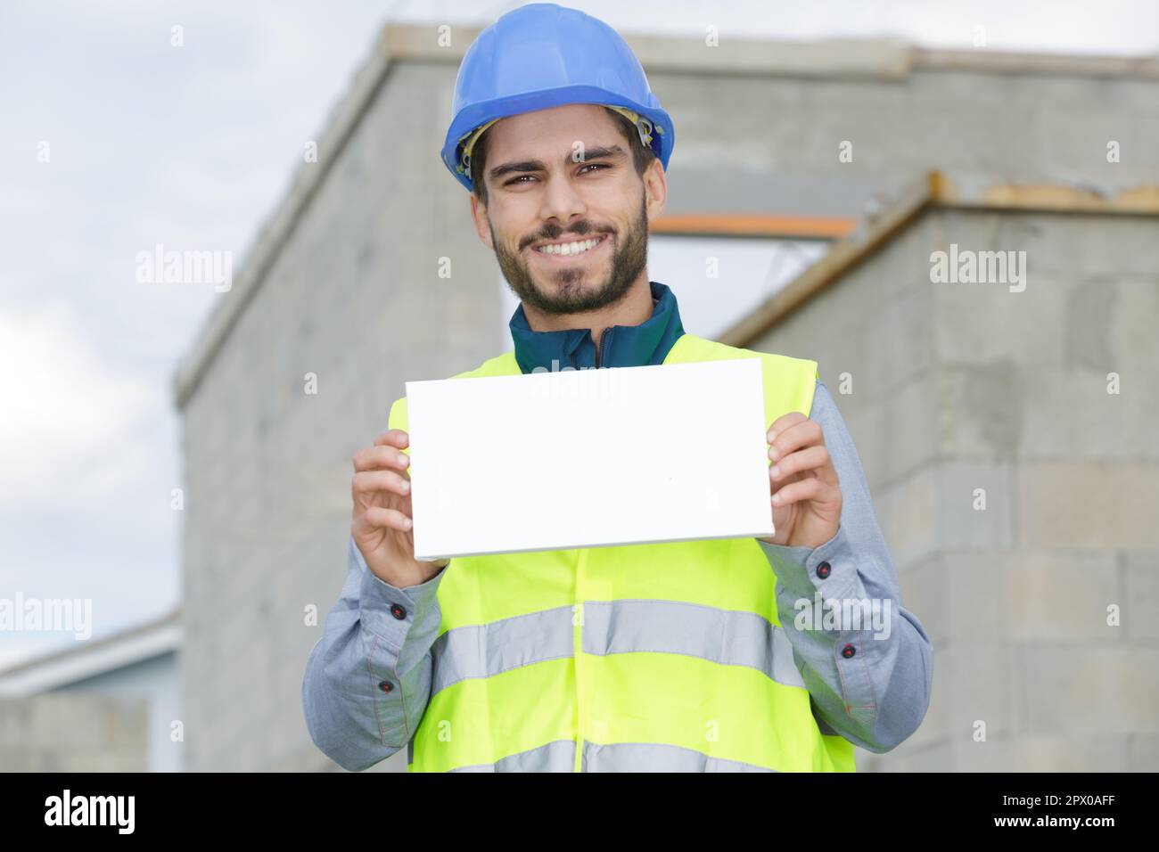 engineer man construction worker holding blank advertising banner Stock ...