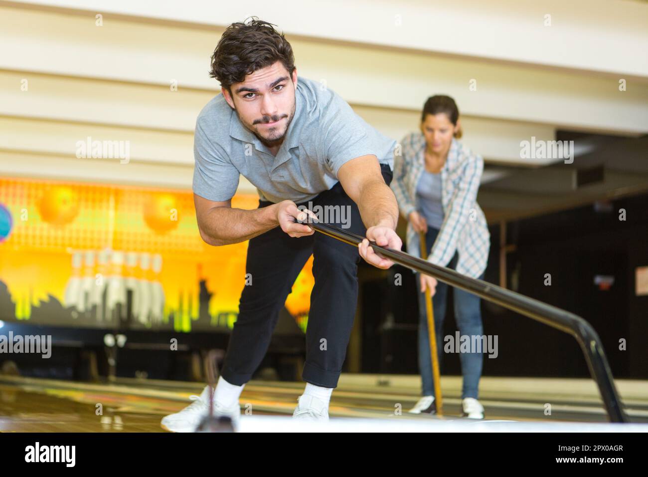 friends bowling at club Stock Photo - Alamy
