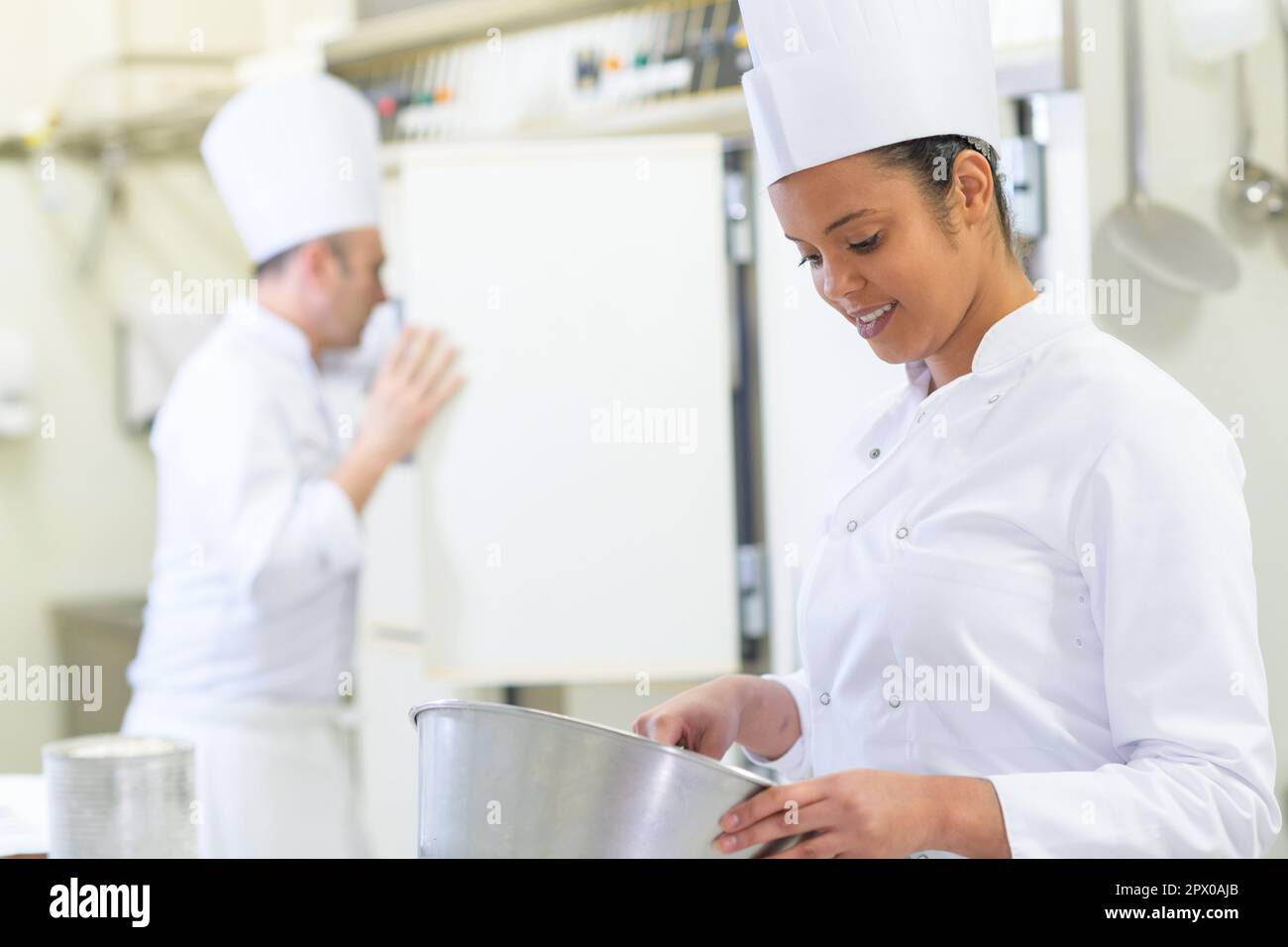 a happy female chef assistant Stock Photo - Alamy