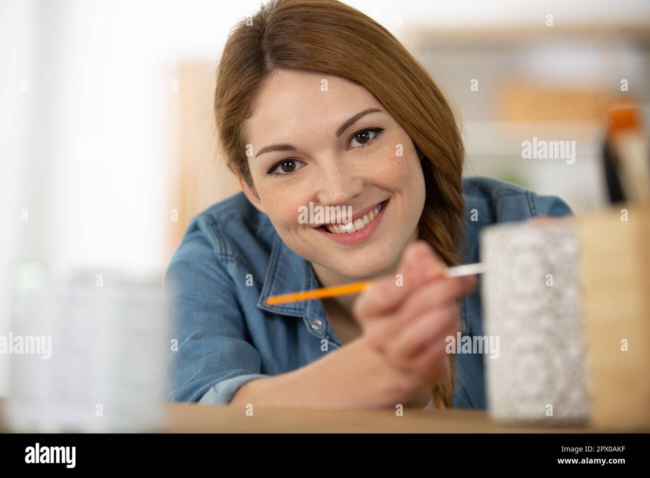 Woman making pattern on clay hi-res stock photography and images - Alamy