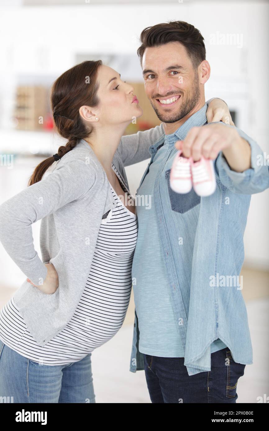 Kissing baby bump hi-res stock photography and images - Alamy