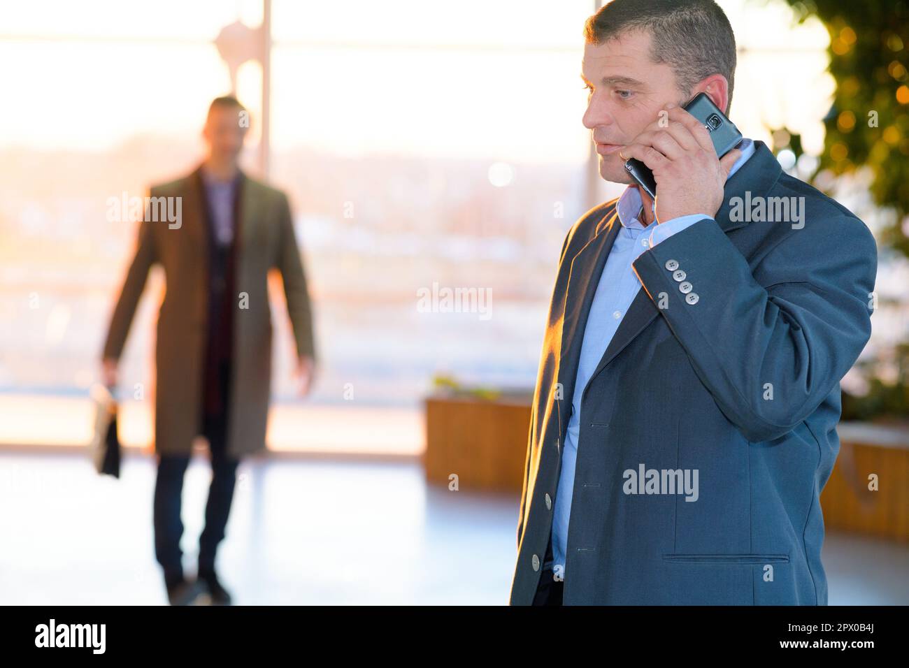 men in formal attire in the lobby Stock Photo - Alamy
