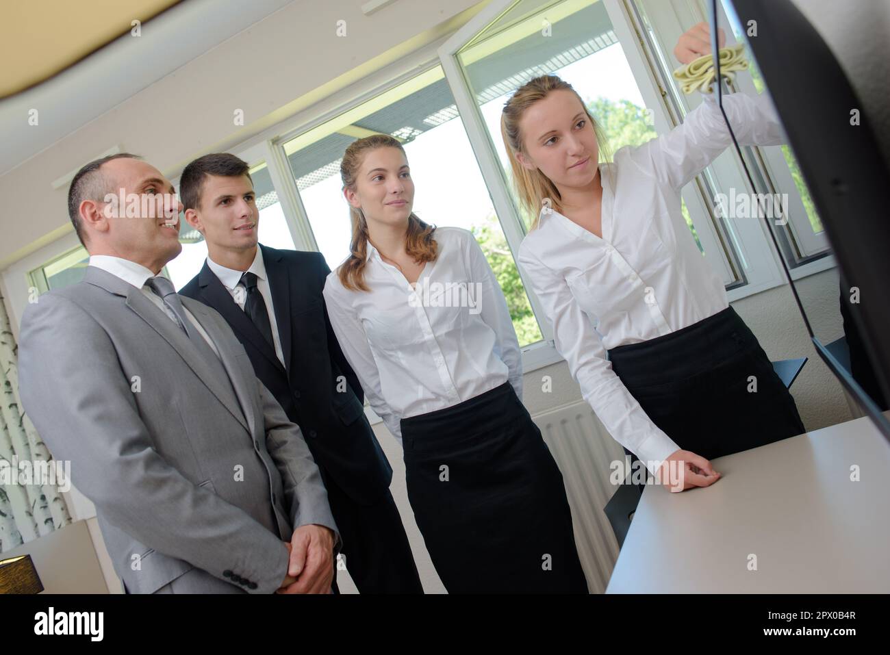 apprentices and boss - staff Stock Photo - Alamy
