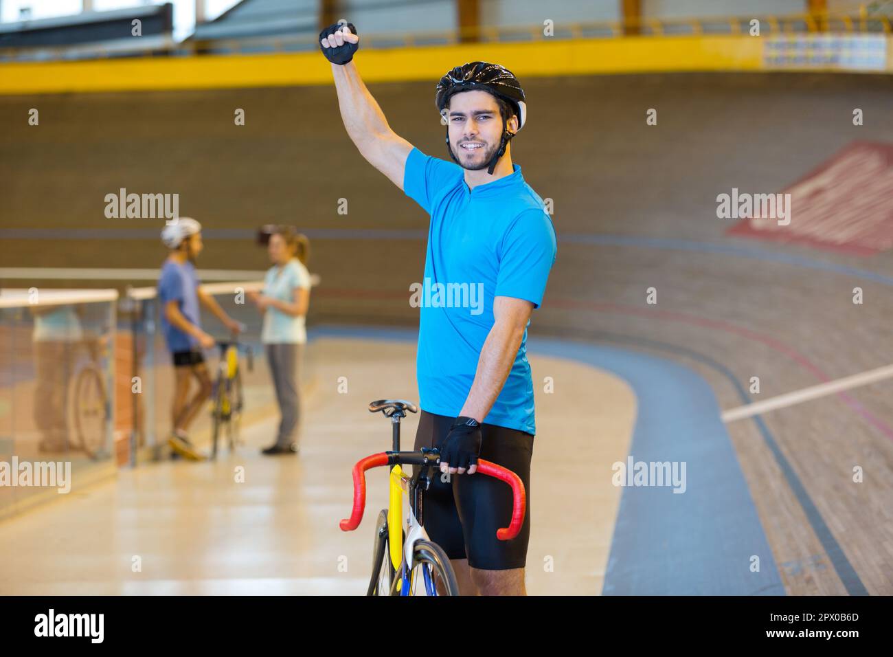 smiling athlete on a cycle track Stock Photo - Alamy