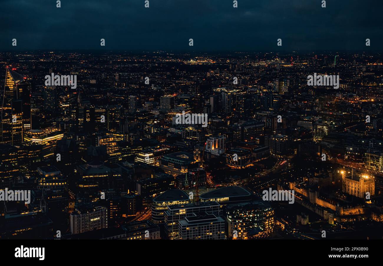 Aerial view of north east London, just after dark, orange yellow street ...