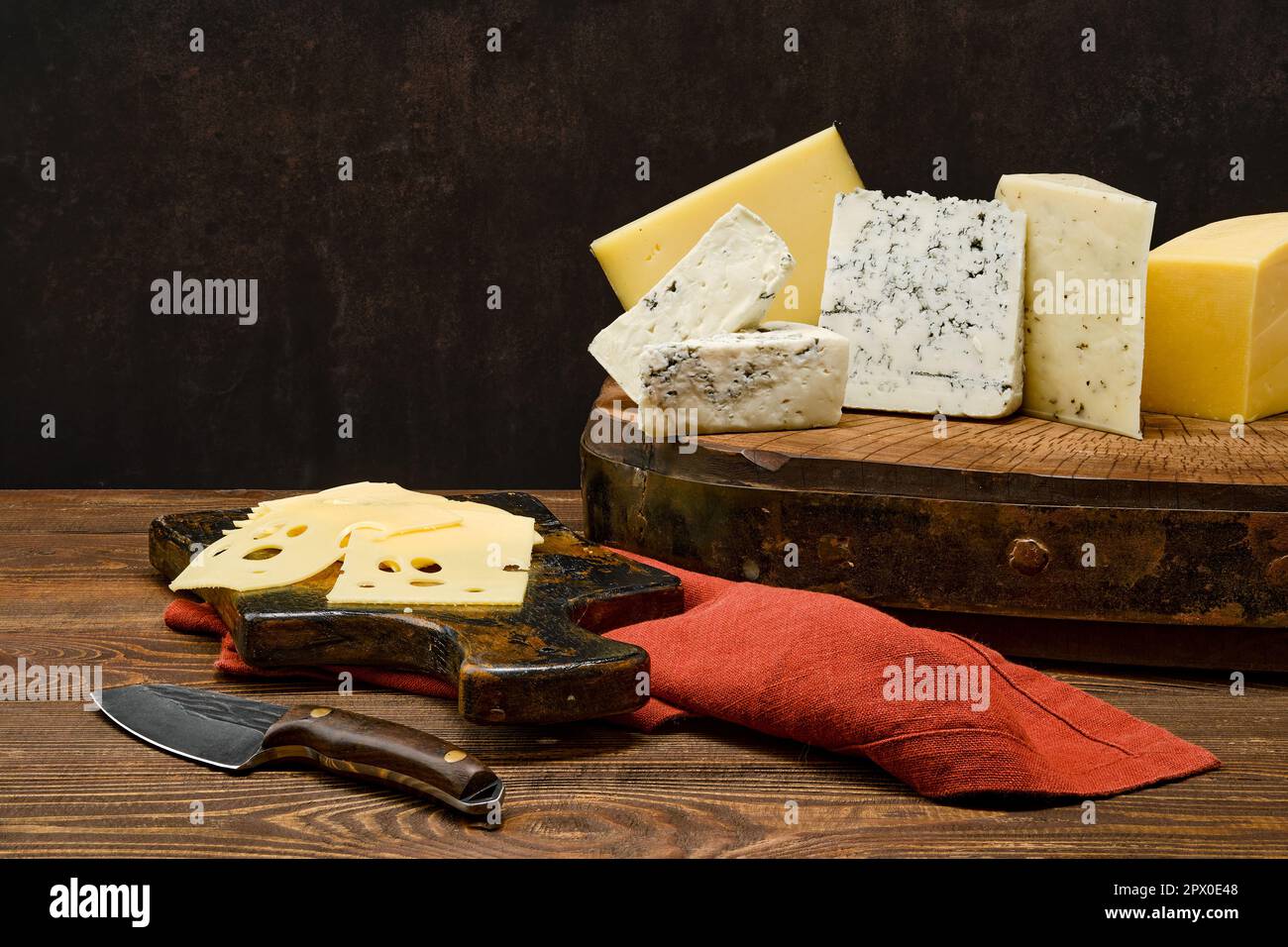 Assortment of different types of cheese on wooden block Stock Photo - Alamy