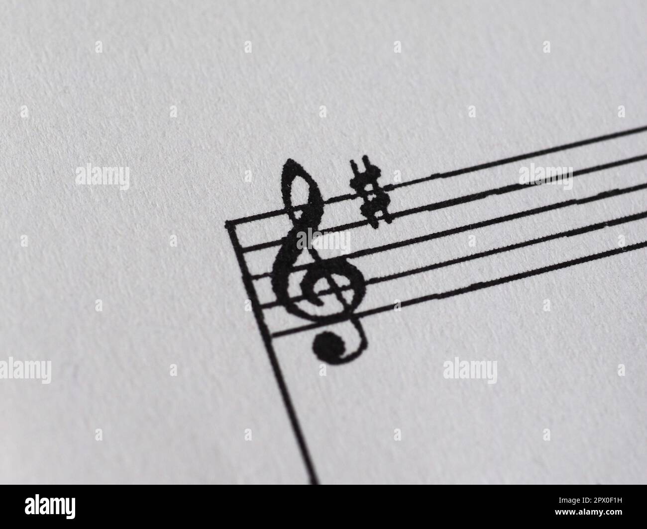 Treble clef and sharp on a music staff Stock Photo - Alamy