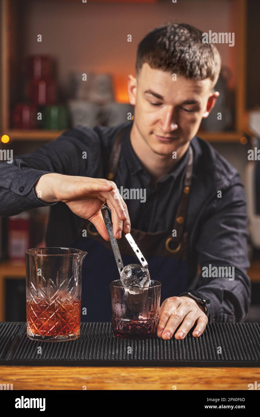 Barman making cocktail decorated hi-res stock photography and images ...