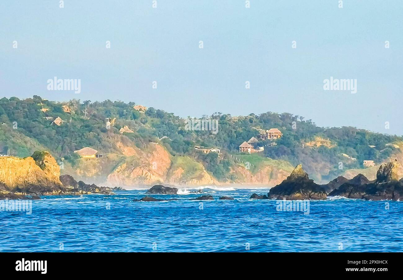 Beautiful paradise beach with mountains cliffs rocks high waves and ...