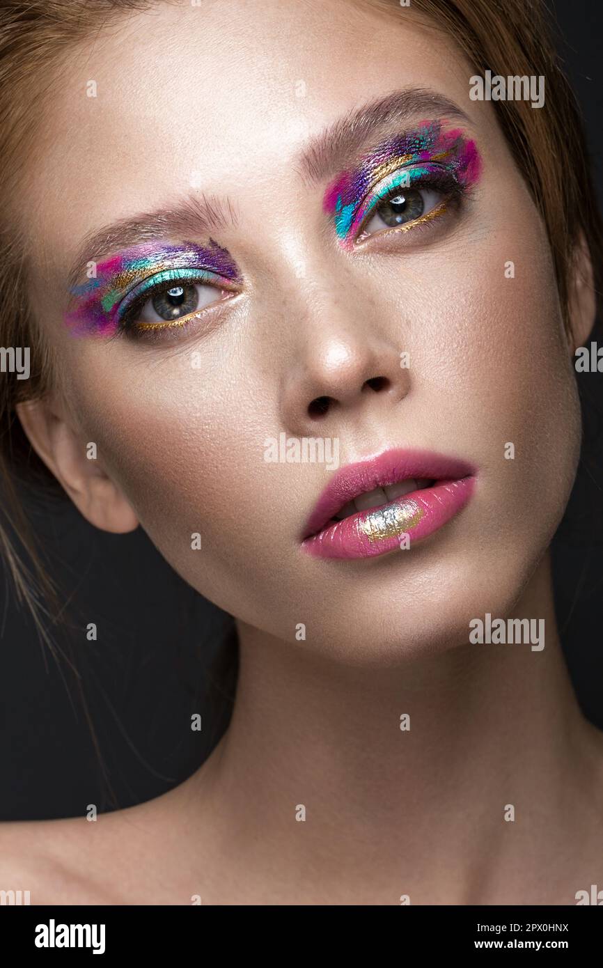 Beautiful girl with creative colorful makeup. Beauty face. Photos shot ...