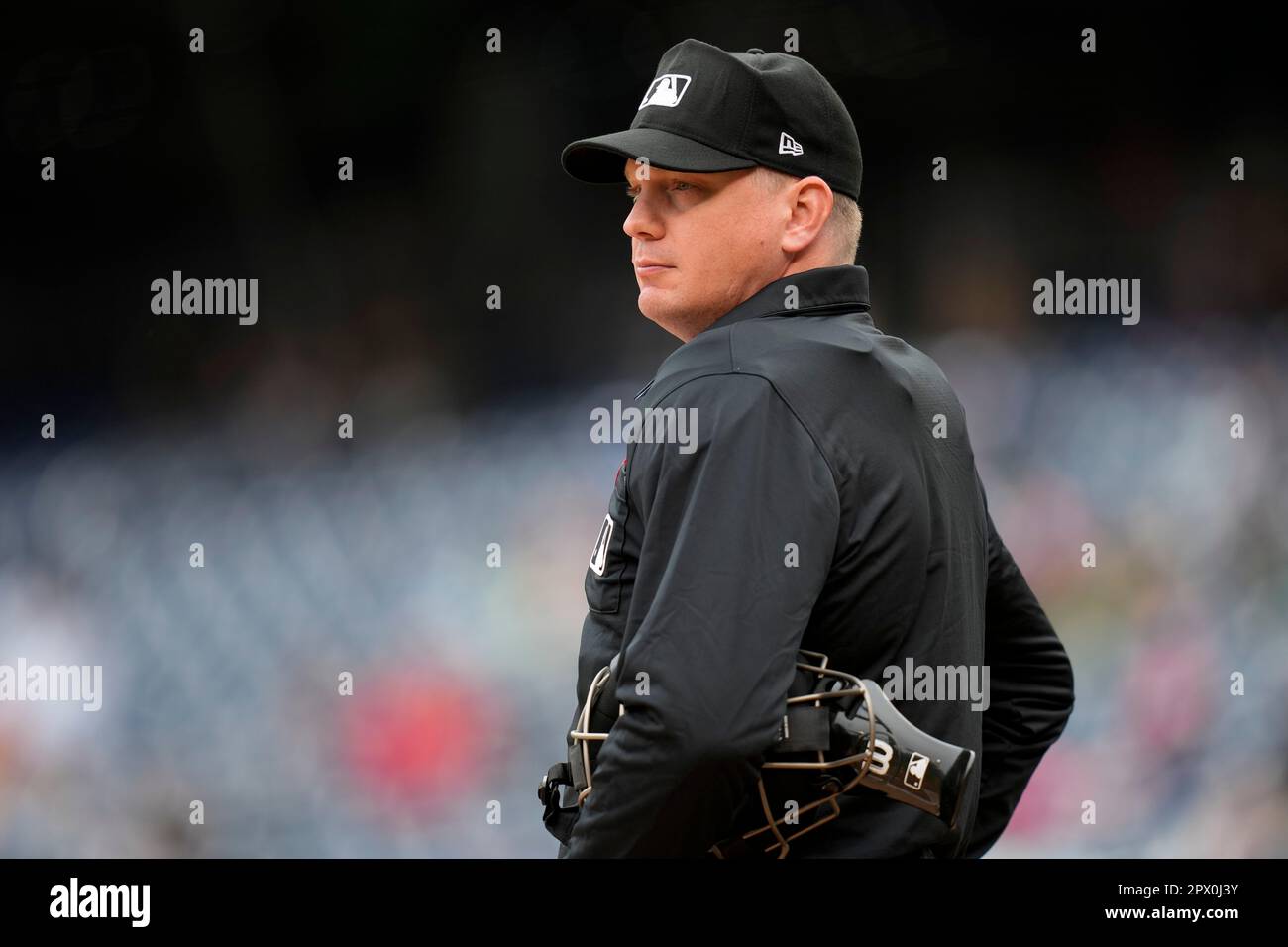Umpire Ryan Wills walks on the field during a baseball game between the ...