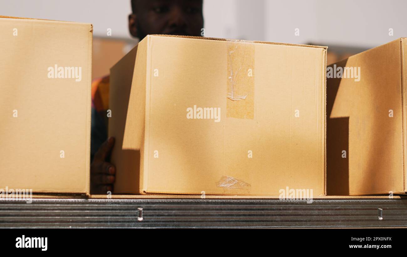 Woman employee moving products packages hi-res stock photography and ...