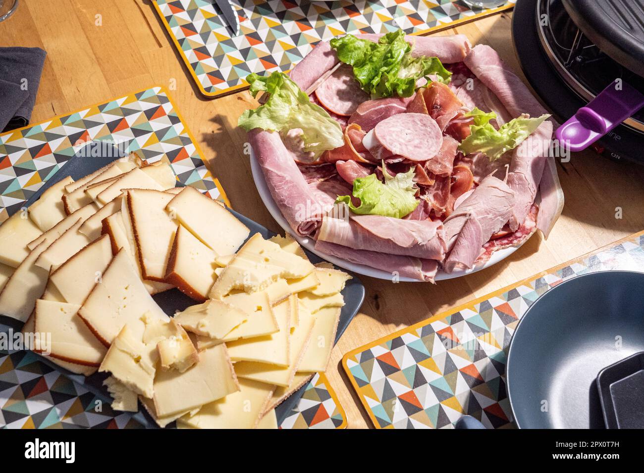 Raclette cheese and meat, a french tradition Stock Photo - Alamy