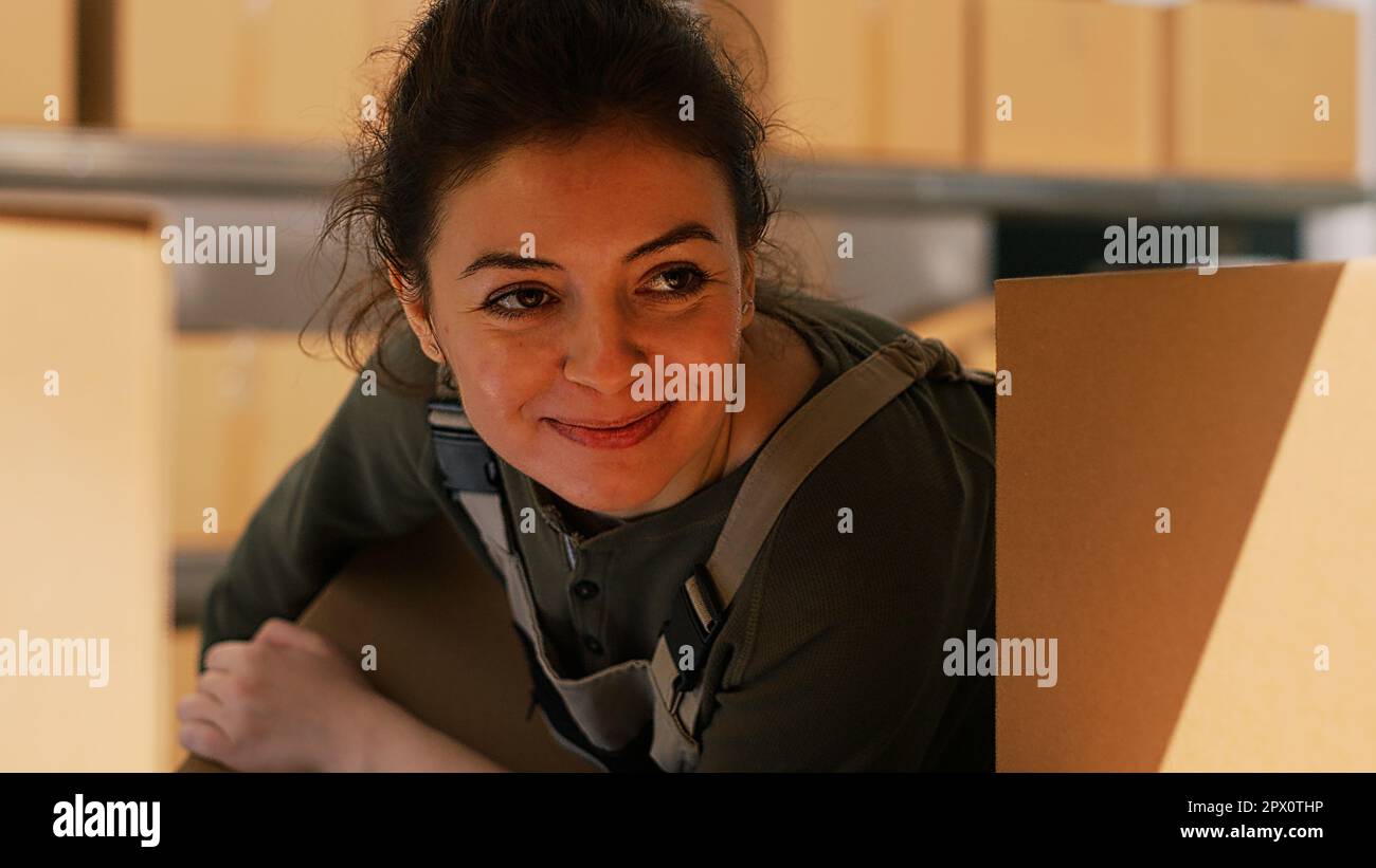 Woman employee moving products packages hi-res stock photography and ...
