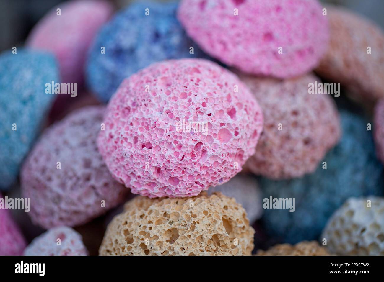 Colored natural pumice stones at the stand on street bazaar in Dahab ...
