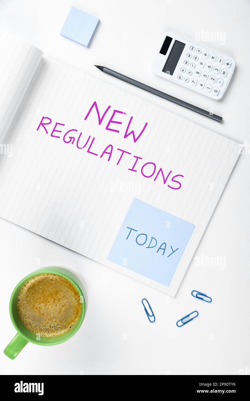 Hand writing sign New Regulations, Business concept Regulation ...