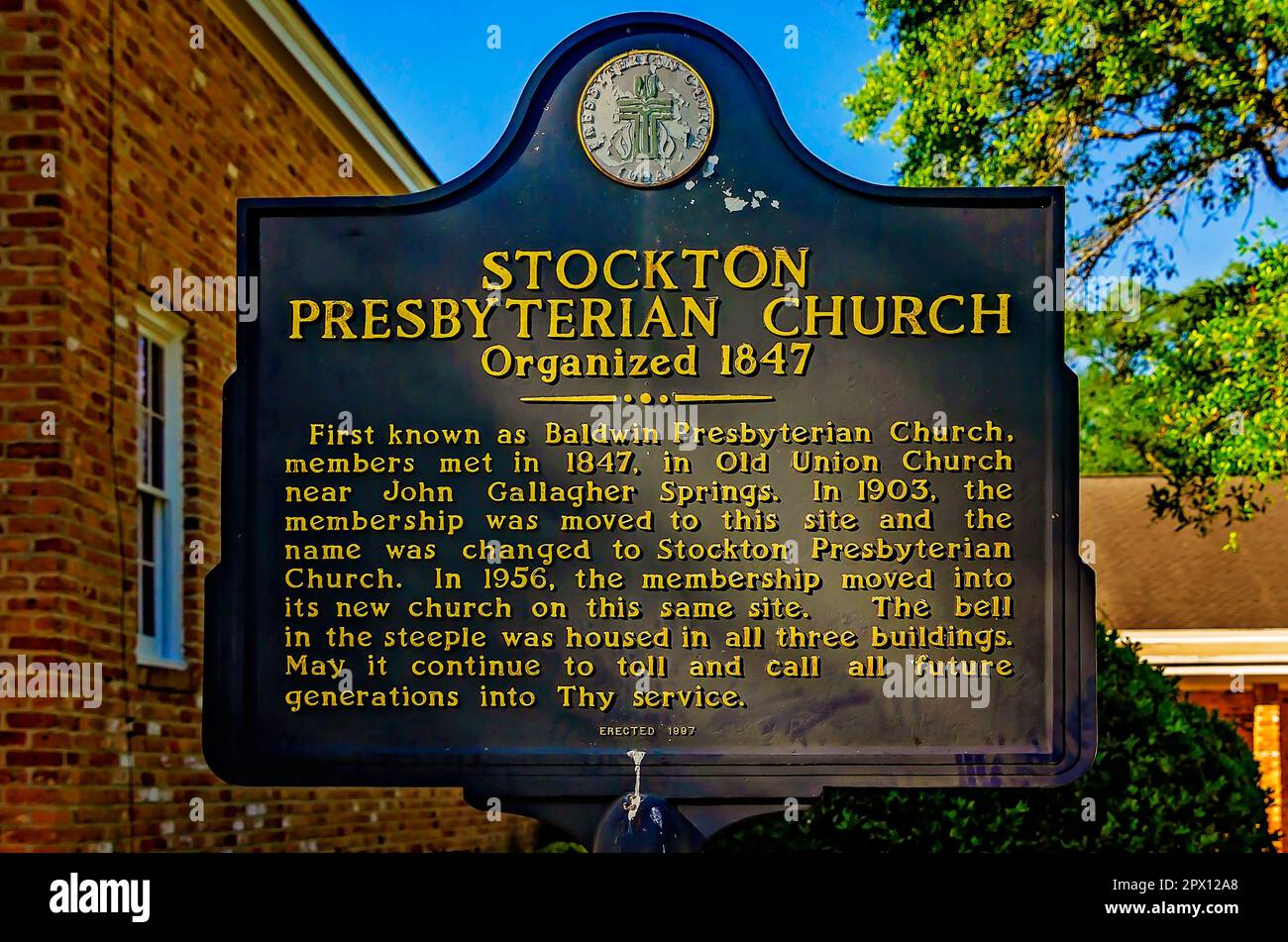 A historic marker stands in front of Stockton Presbyterian Church ...