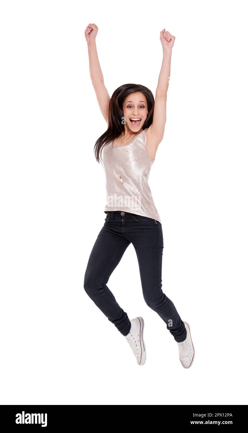 What a pleasant surprise. Portrait of a beautiful young woman jumping ...